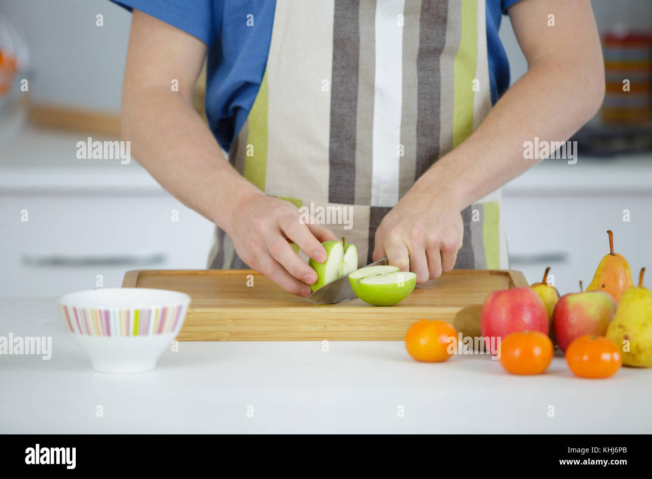 man cutting apples Stock Photo - Alamy