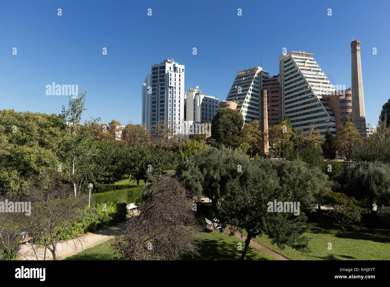 Gardens of the Turia with buildings of the city of Valencia in the ...