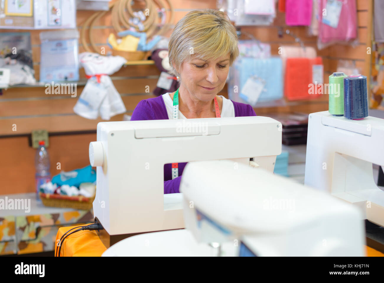 woman sewing on sewing-machine Stock Photo - Alamy