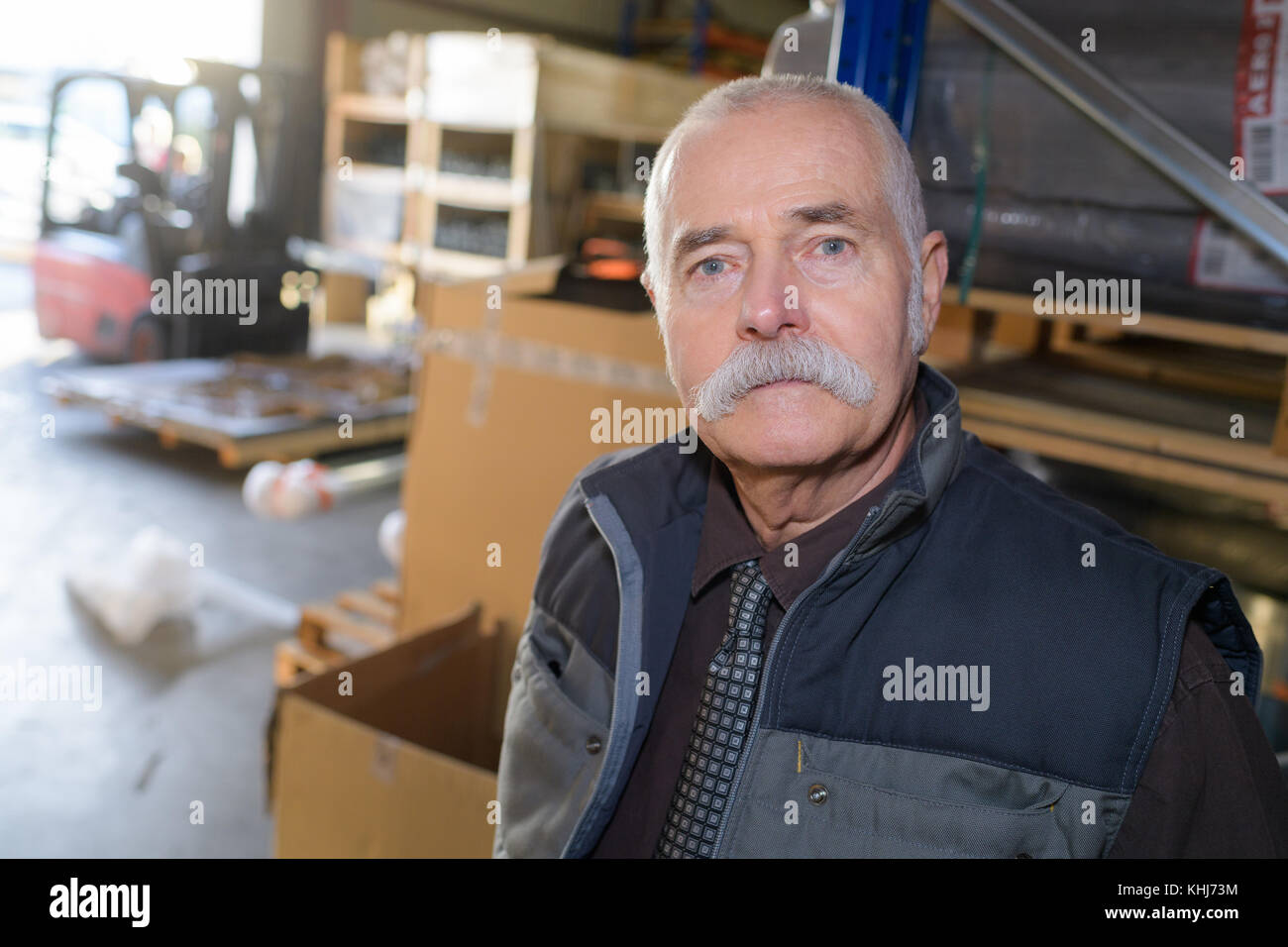 senior warehouse worker portrait Stock Photo - Alamy