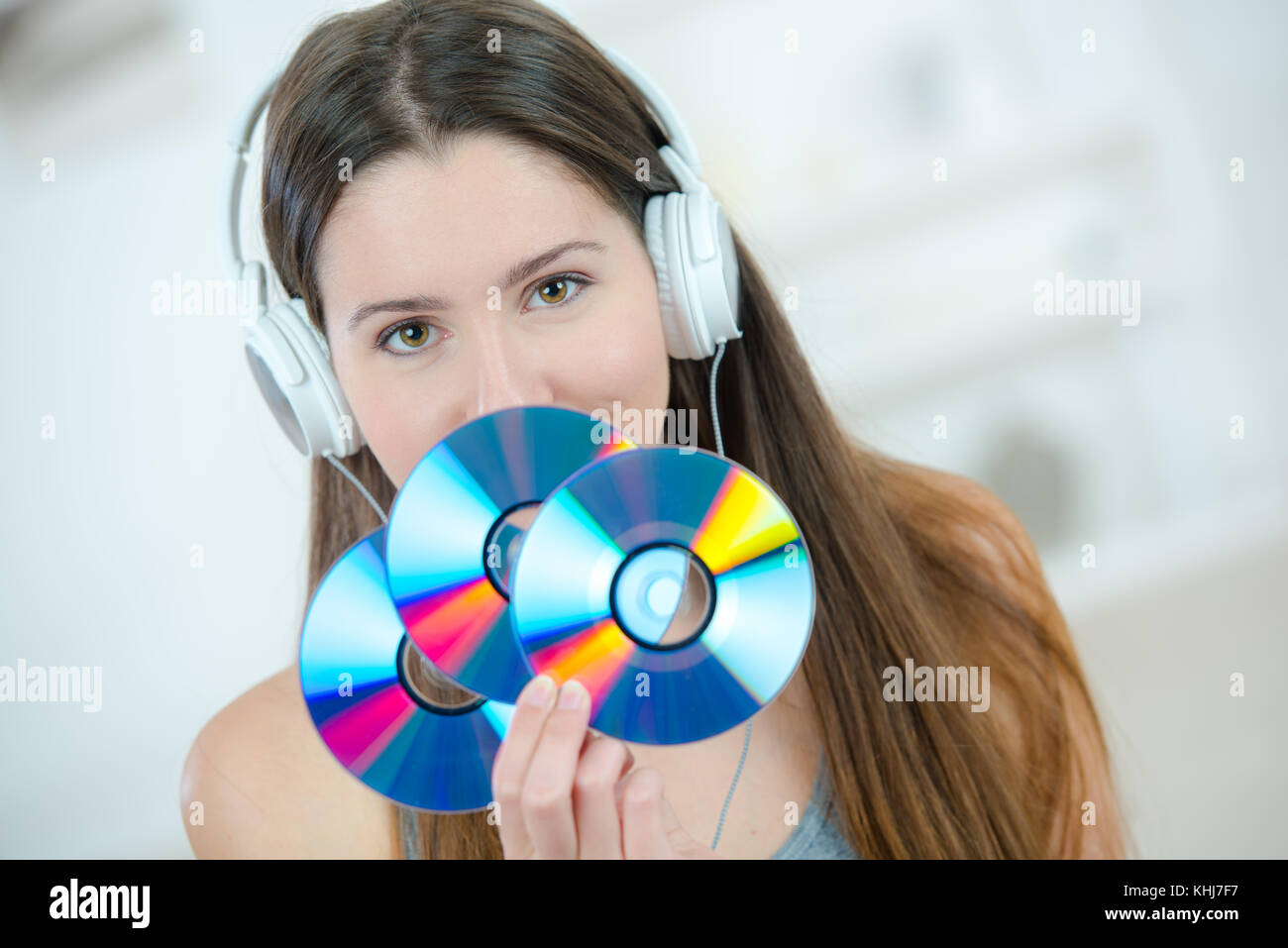 young woman holding dvd-rom Stock Photo - Alamy