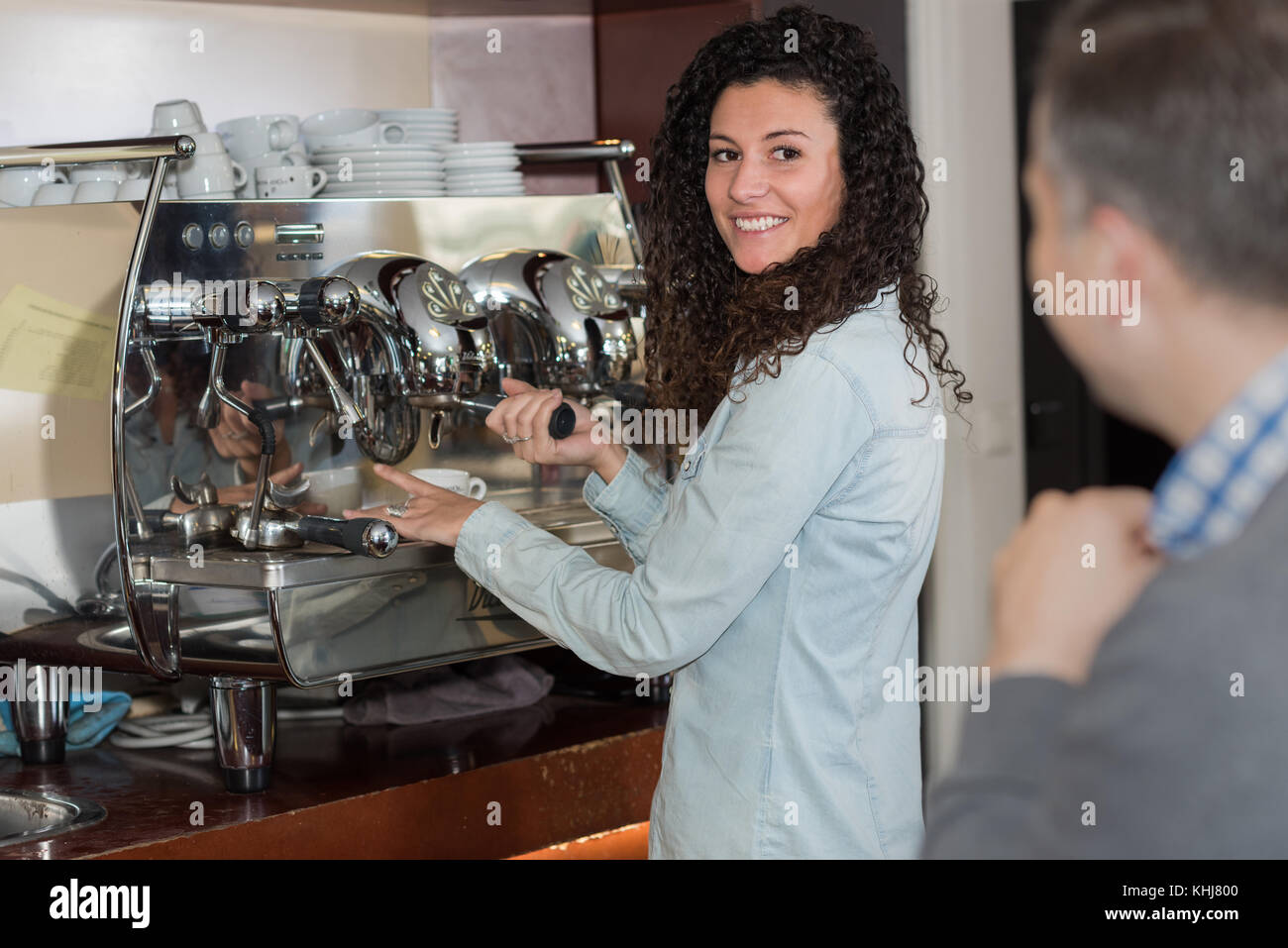 fresh beverage pouring from the coffee machine Stock Photo - Alamy