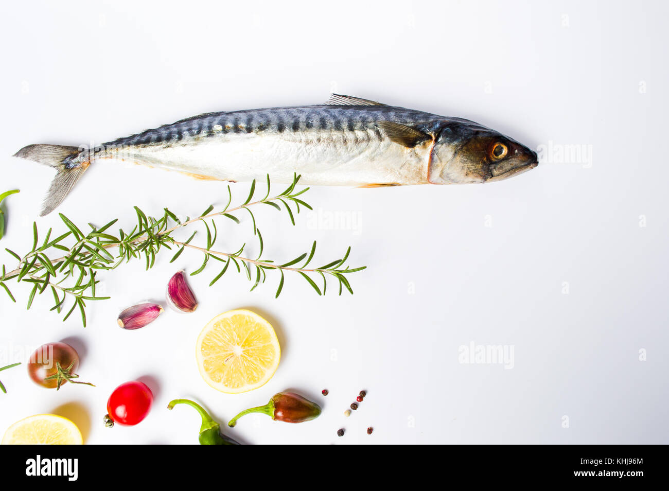 Raw mackerel fish with spices isolated on white background Stock Photo ...