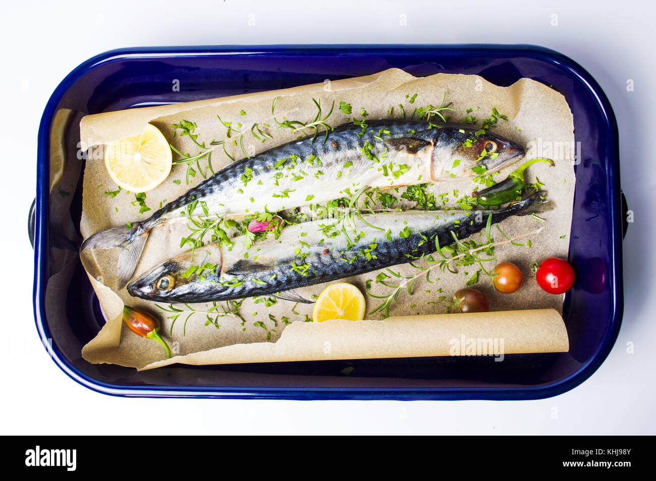 Mackerel fish with cooking ingredients on a baking pan Stock Photo - Alamy