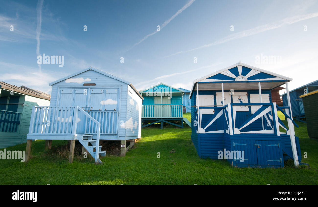 Colorful wooden beach huts at the seaside of Whitstable at Kent area in ...