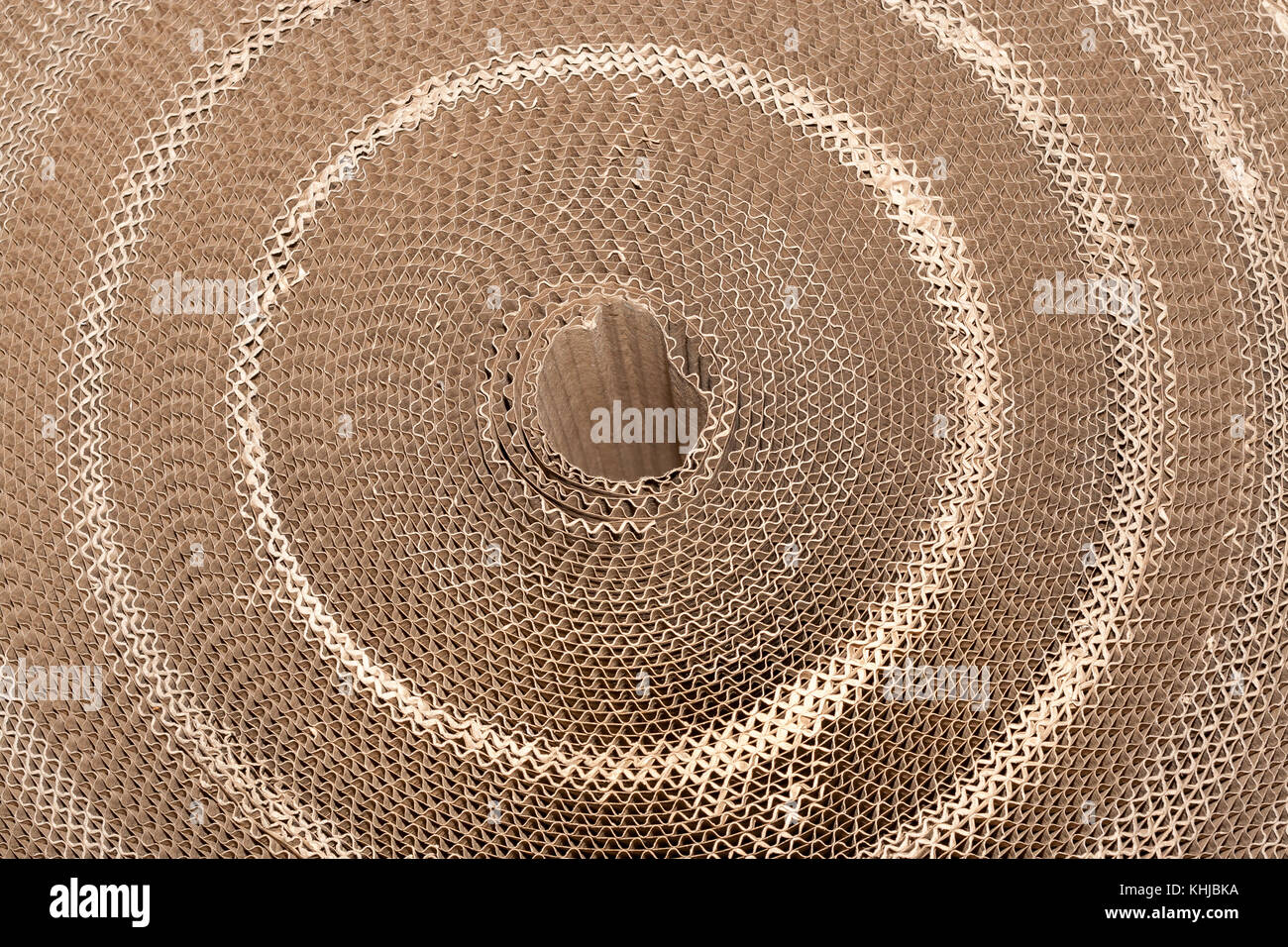 Circular coil of corrugated cardboard. Top view Stock Photo - Alamy