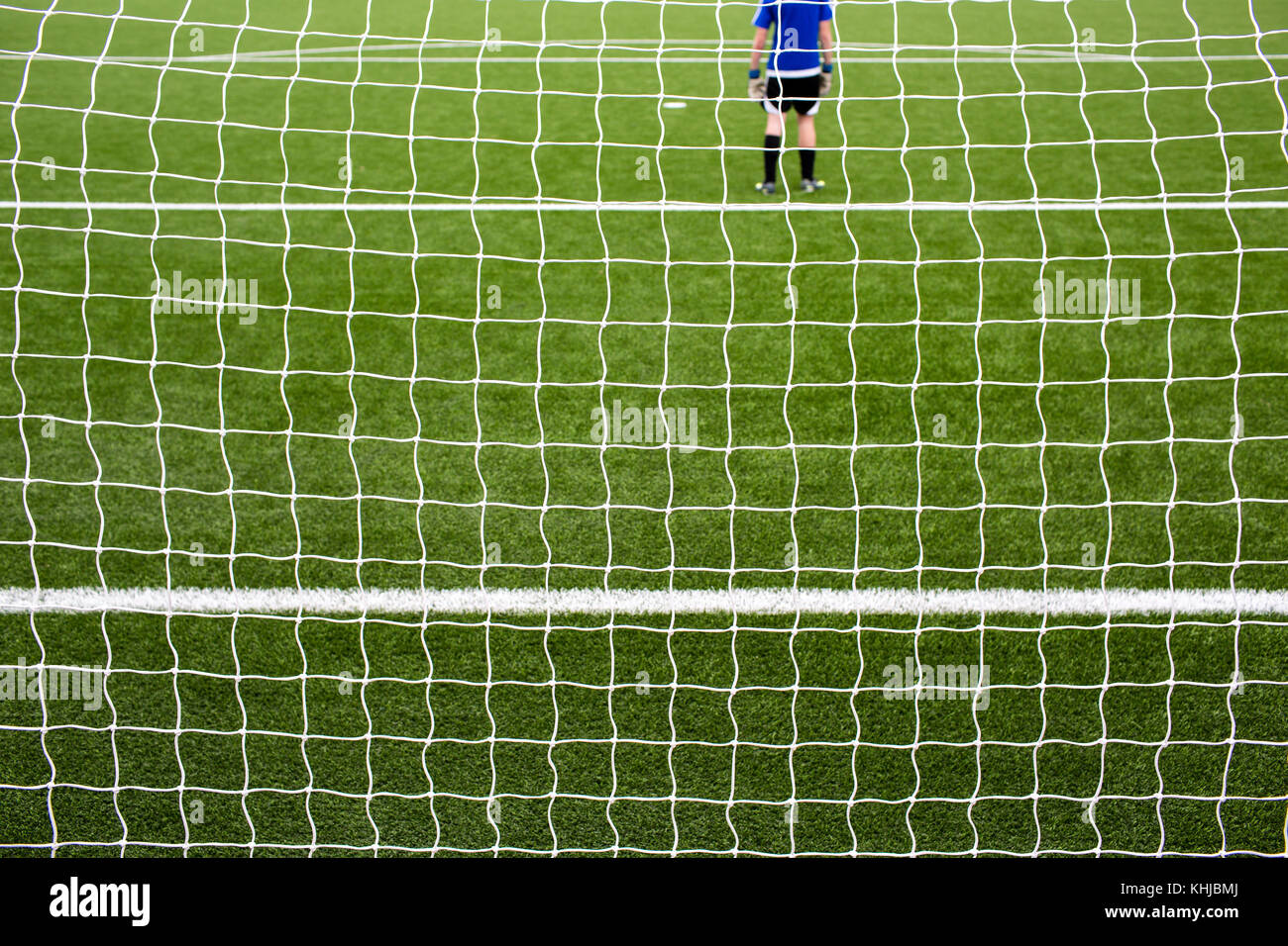 A new artificial sports pitch with white lines in the plastic grass ...