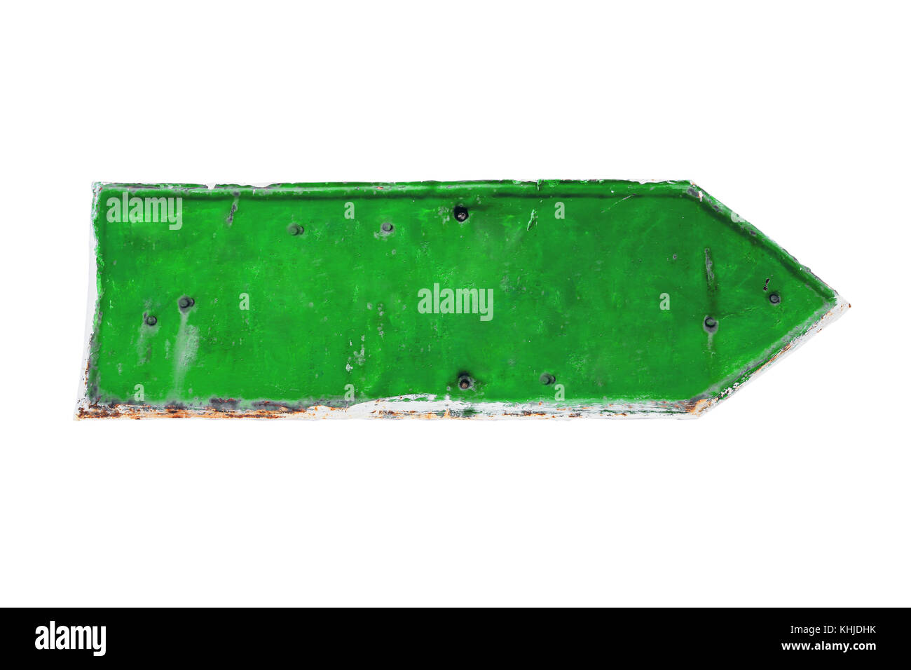Green arrow shape from a rusty and grunge metal iron plate with peeling ...