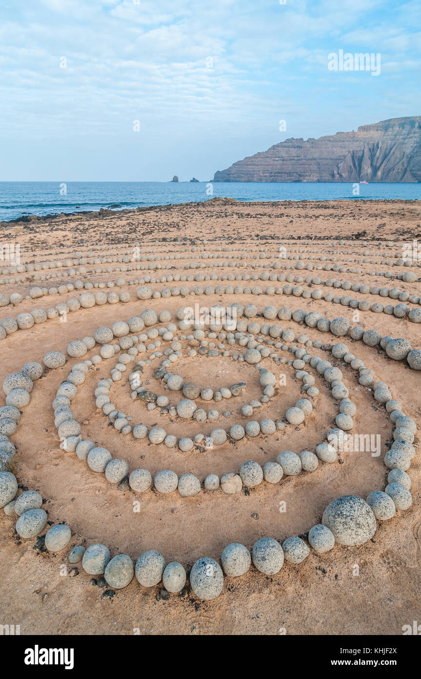 completely circular stones on the ground forming a spiral near the ...
