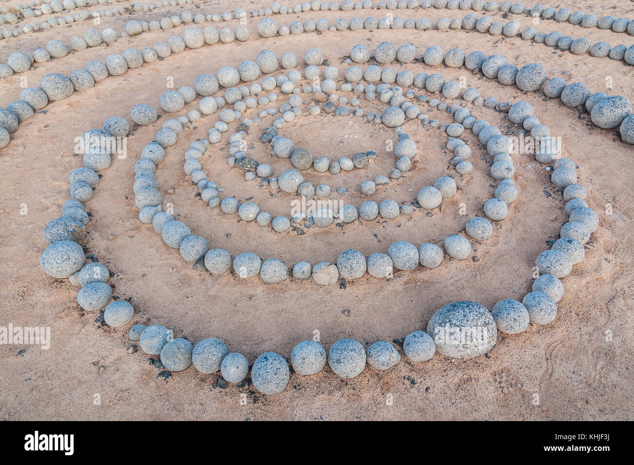 completely circular stones on the ground forming a spiral near the ...