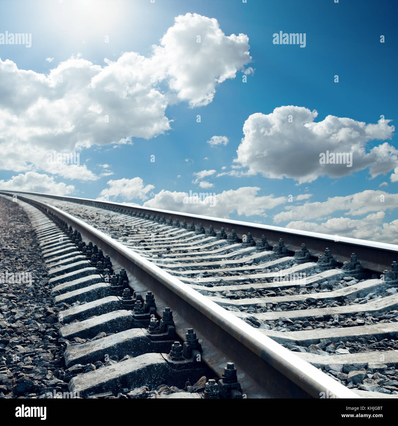 railroad closeup to horizon in sky with sun Stock Photo - Alamy
