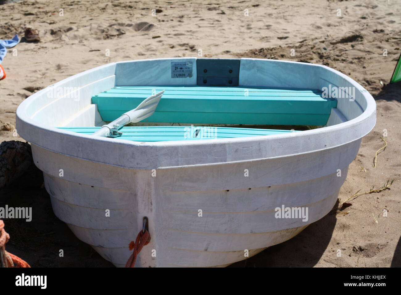 A small rowing raft boat on the beach sand Stock Photo - Alamy