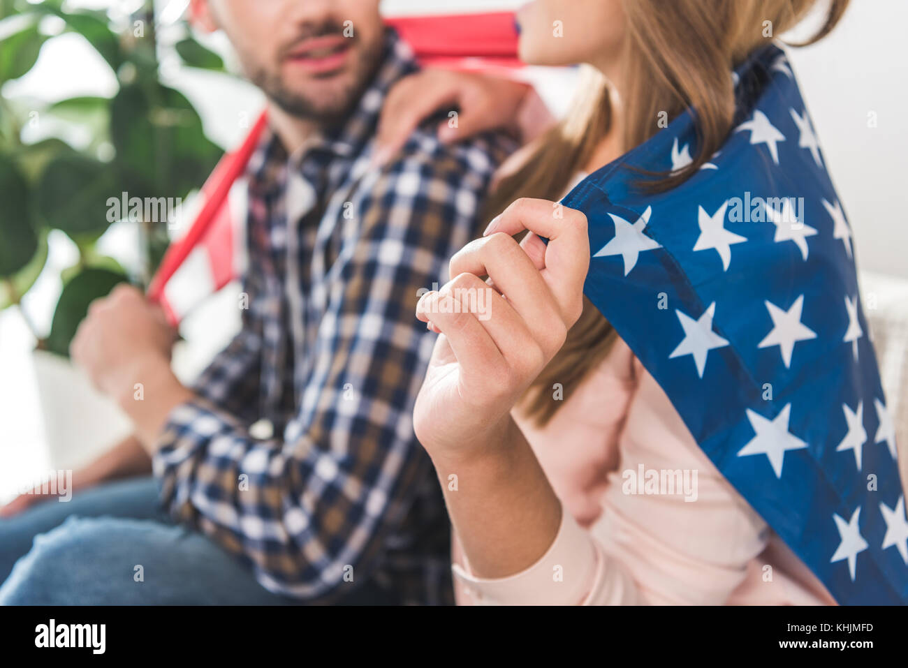 couple wrapped in American flag Stock Photo - Alamy