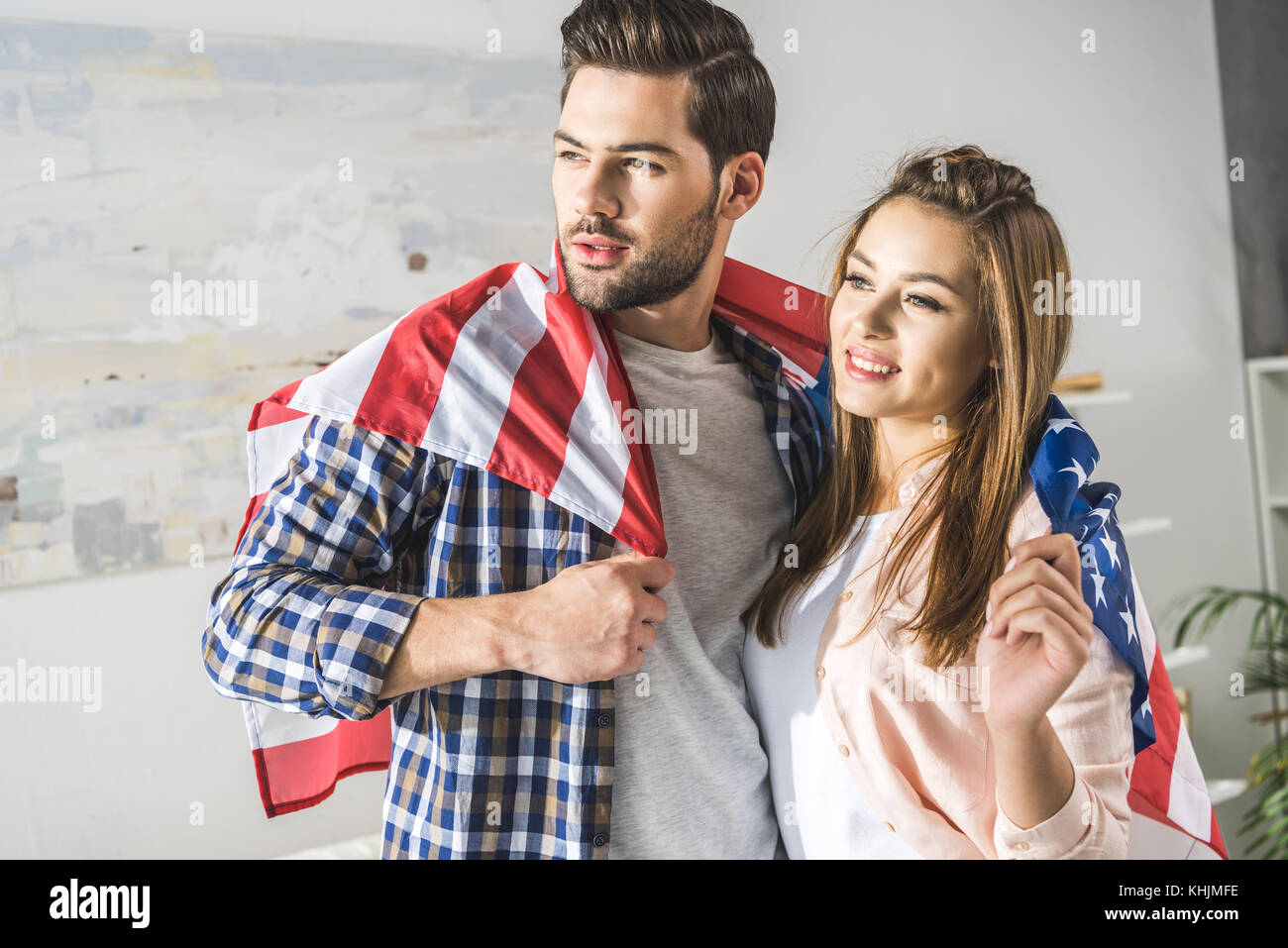 couple wrapped in American flag Stock Photo - Alamy