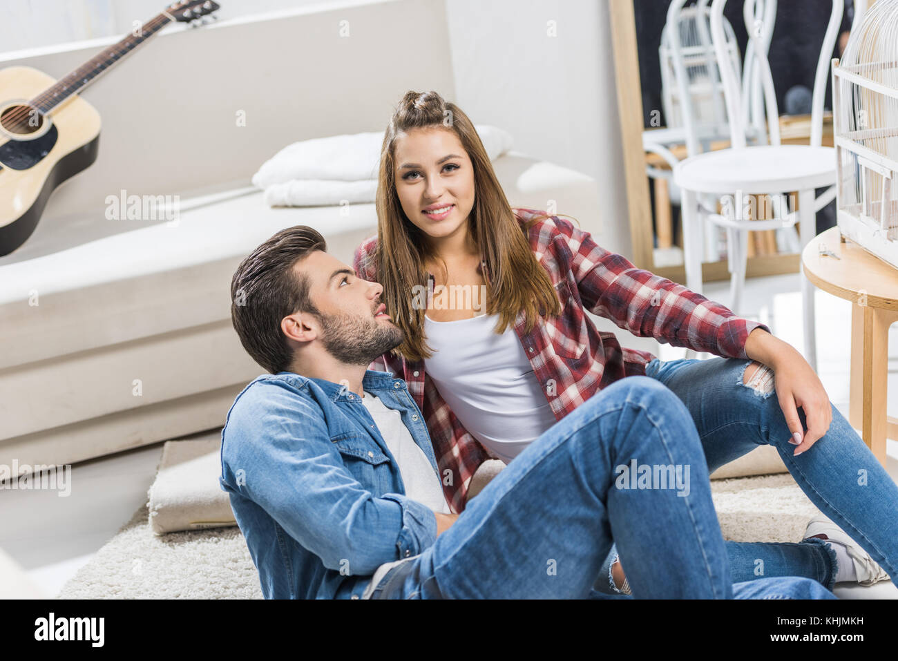 Couple relaxing together on floor hi-res stock photography and images ...