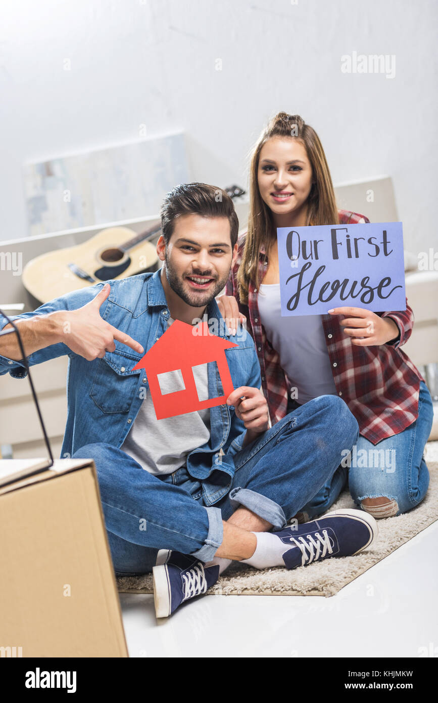 couple showing house signs Stock Photo - Alamy