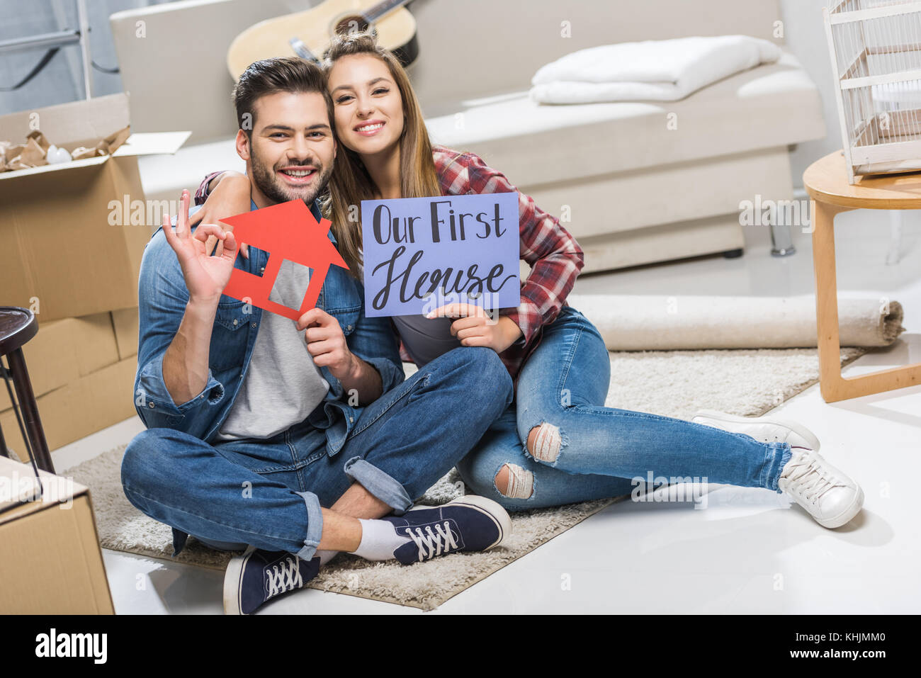 couple showing house signs Stock Photo - Alamy