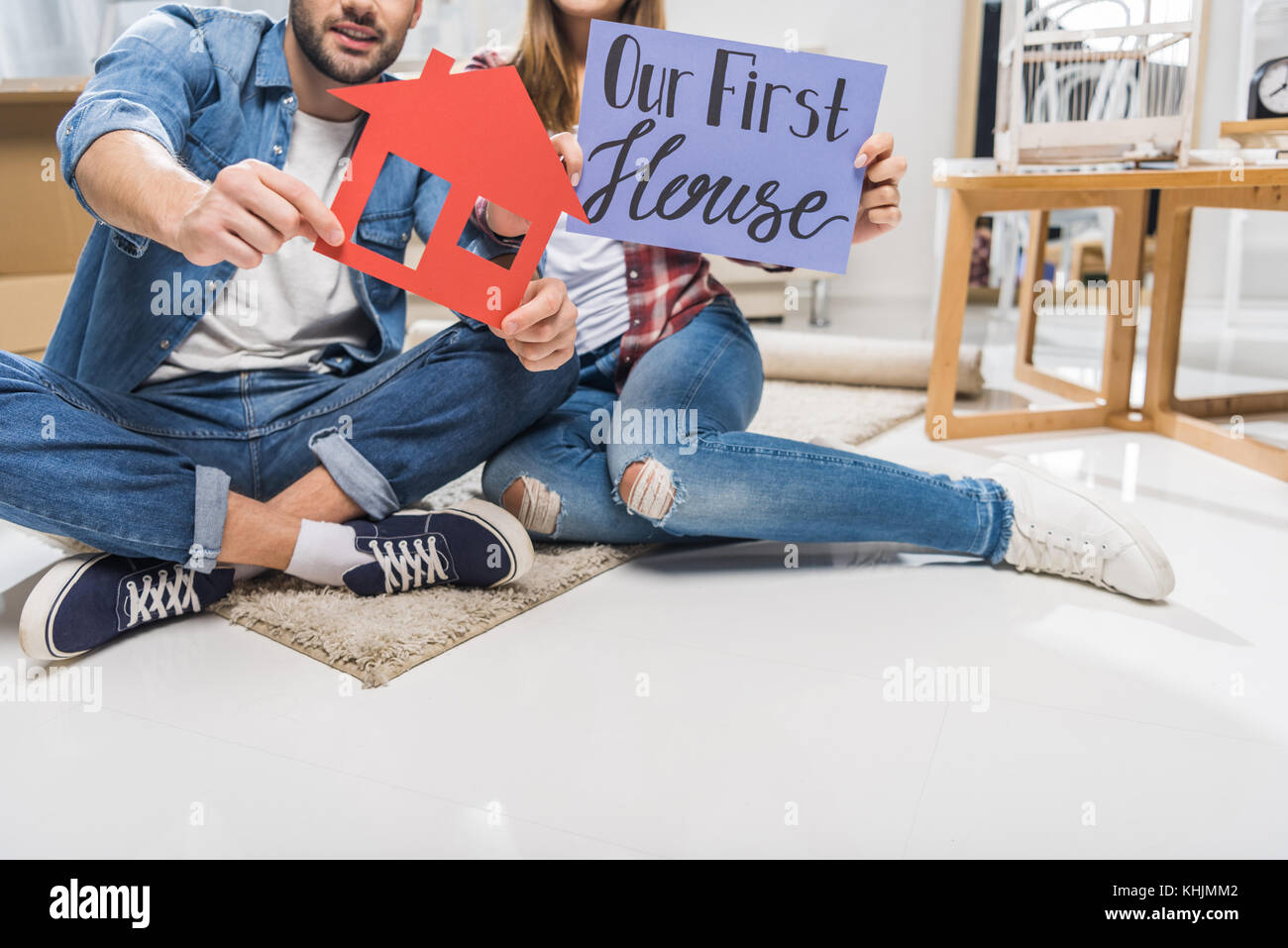 couple showing house signs Stock Photo - Alamy