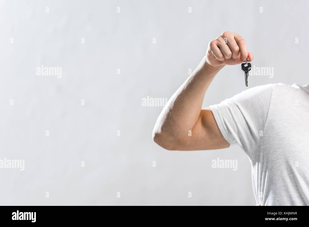man showing key Stock Photo - Alamy