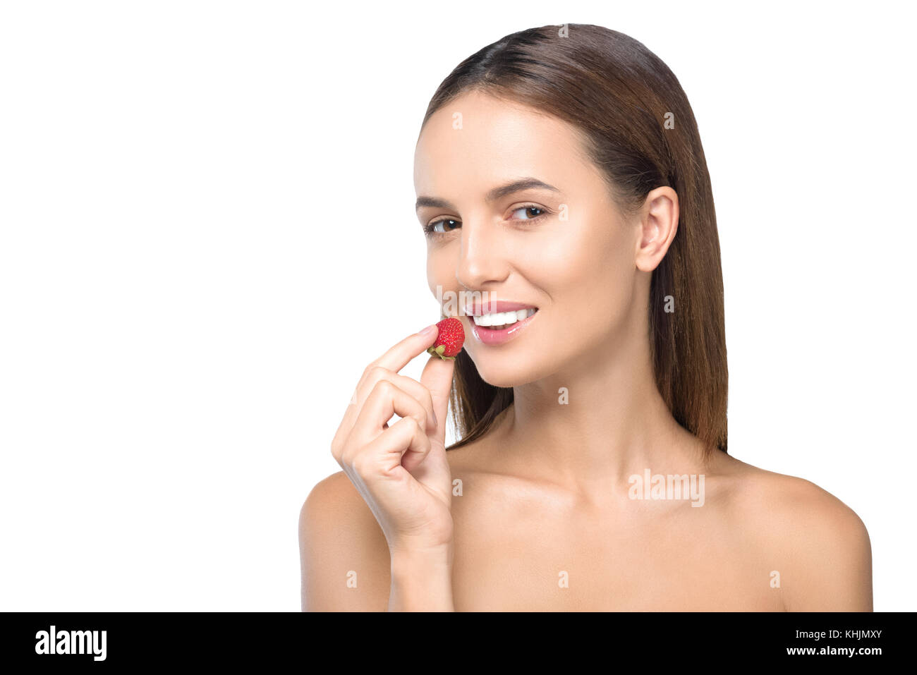 beautiful woman eating strawberry Stock Photo - Alamy