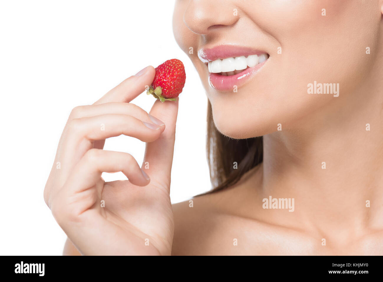 beautiful woman eating strawberry Stock Photo - Alamy