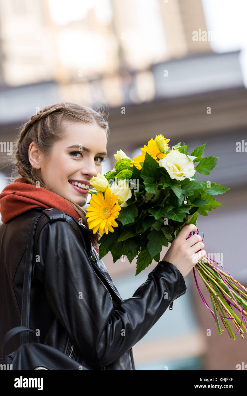 happy woman with bouquet of flowers Stock Photo - Alamy