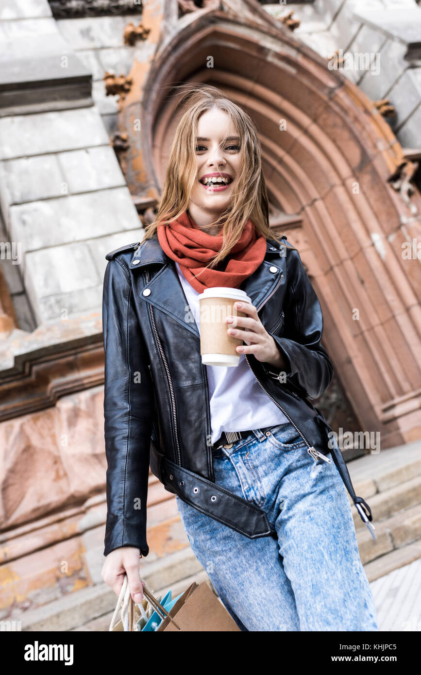 woman with coffee to go on street Stock Photo - Alamy