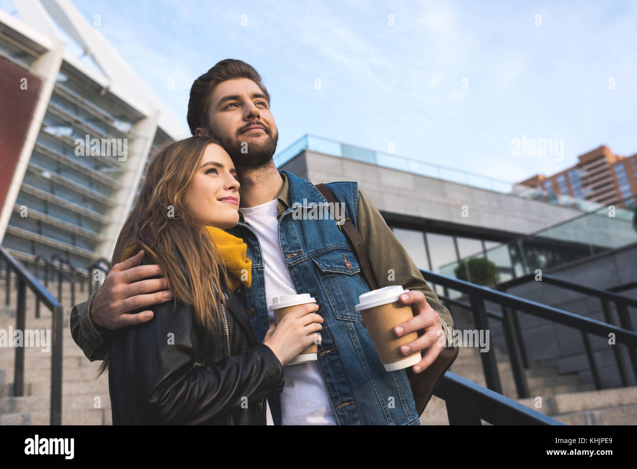 couple with coffee to go on street Stock Photo - Alamy