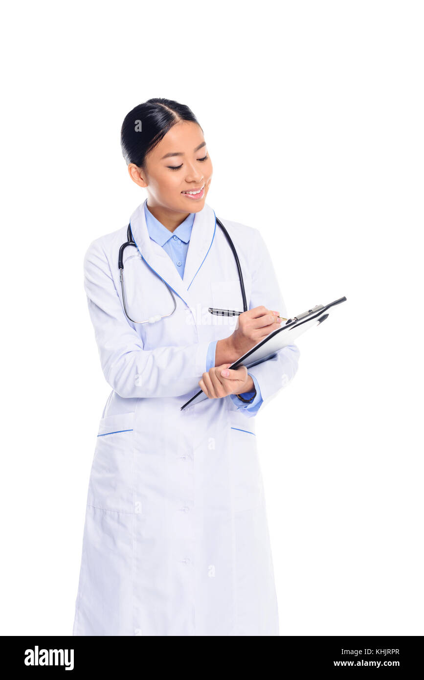 asian doctor writing diagnosis Stock Photo - Alamy