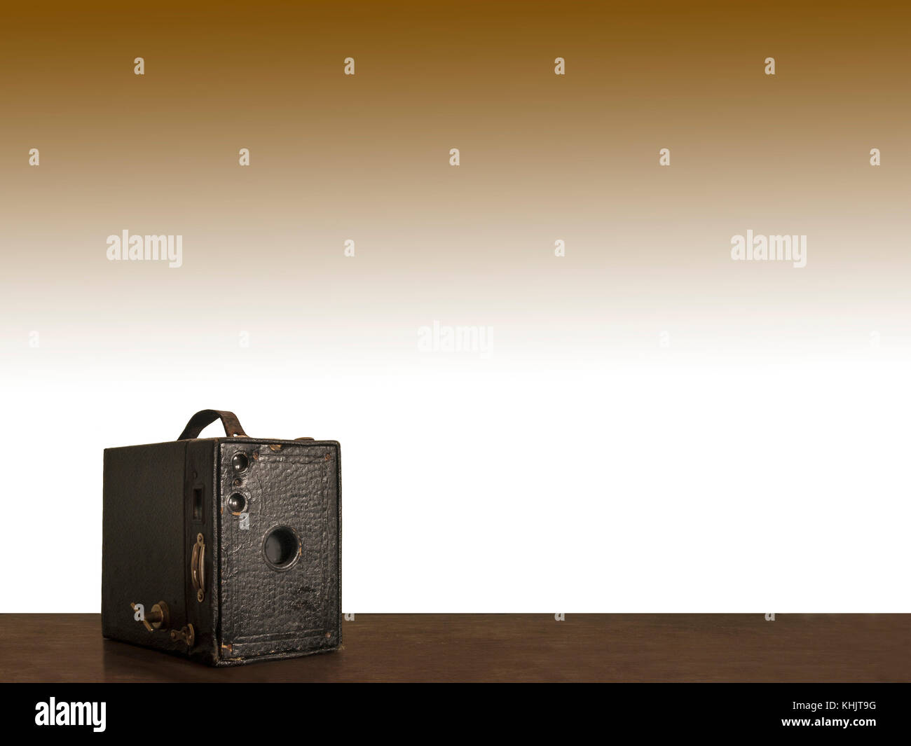 Old box camera with white and brown background Stock Photo - Alamy