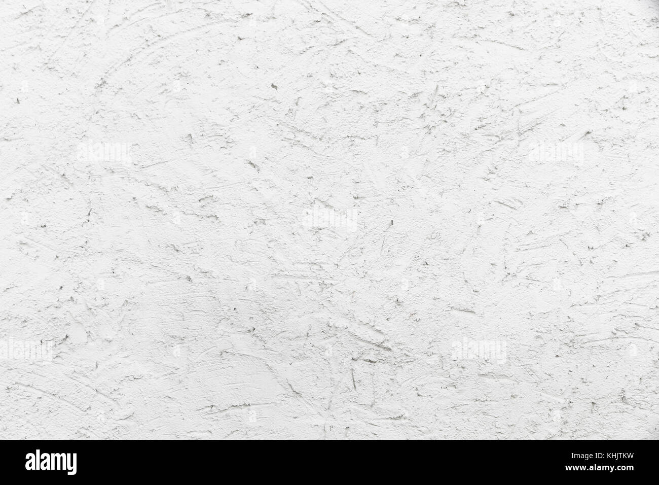 White stucco coarse facade wall made of natural cement as an empty ...