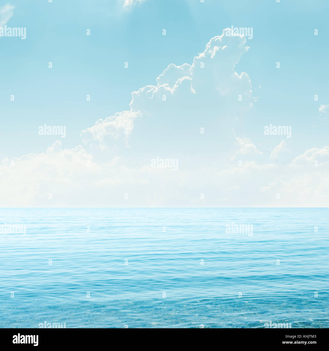 blue sky with clouds and sea in fog Stock Photo - Alamy