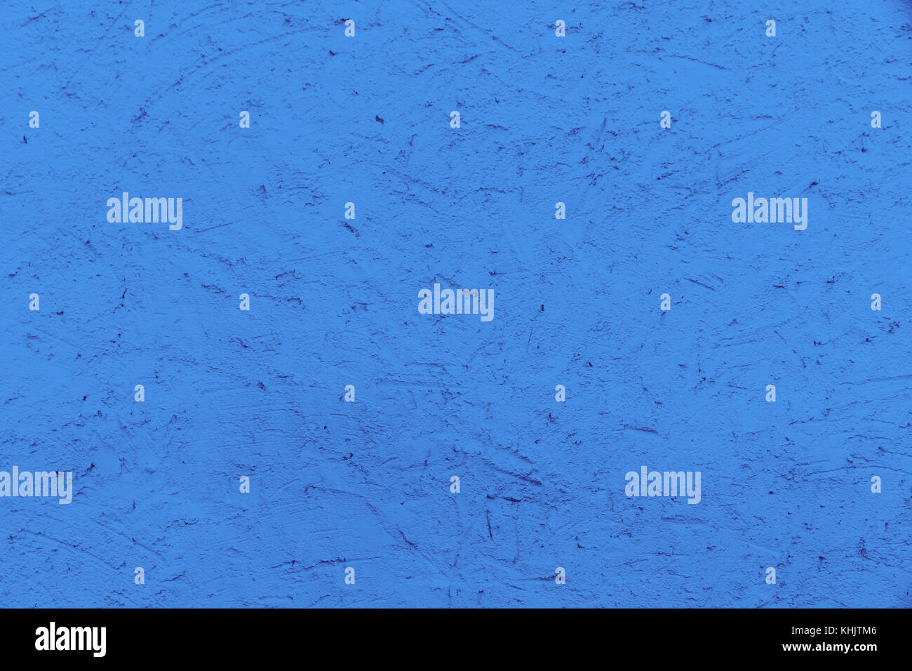 Blue color stucco coarse facade wall made of cement as an empty rustic ...