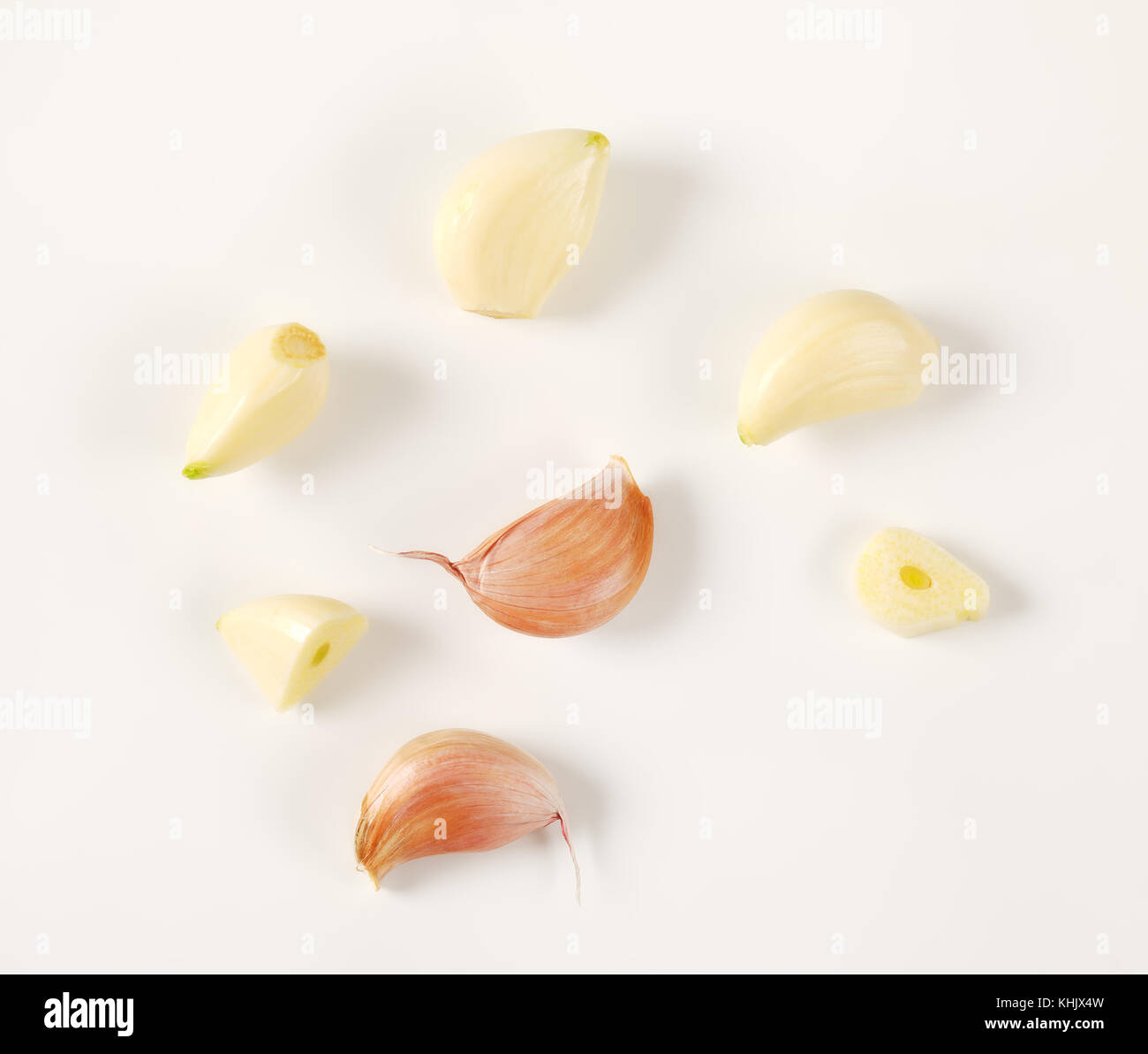 cloves of fresh garlic on white background Stock Photo - Alamy