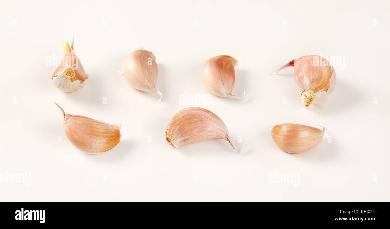 cloves of fresh garlic on white background Stock Photo - Alamy