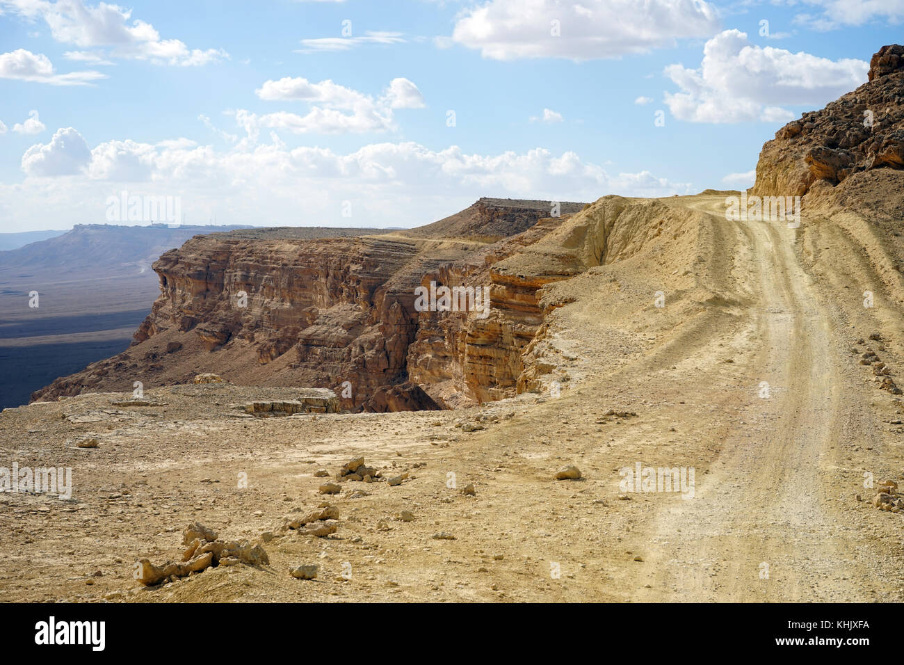 Dirt road on the edge of crater Ramon in Negev desert. Israel Stock ...