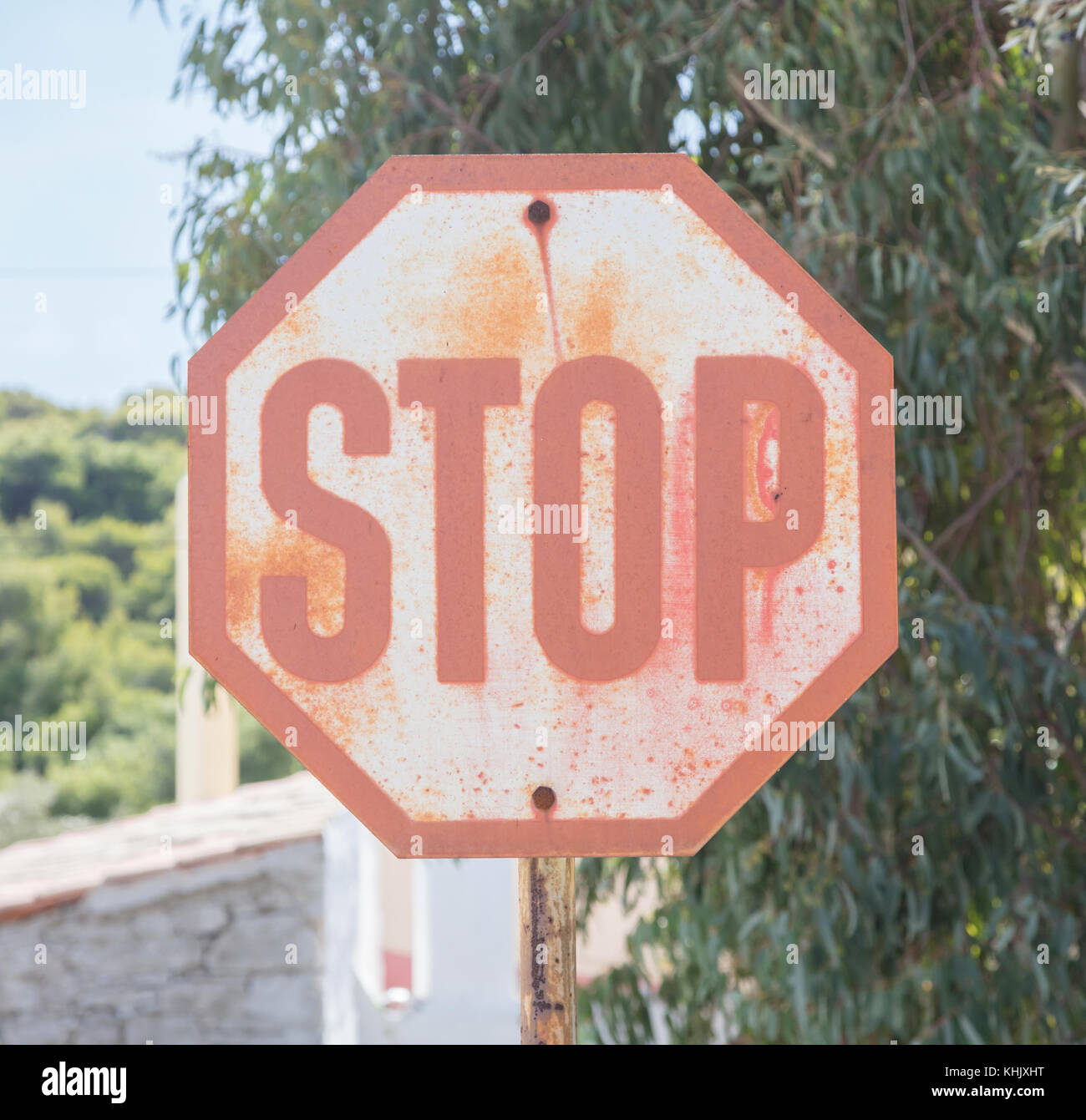 Old stop sign in a village in Greece Stock Photo - Alamy