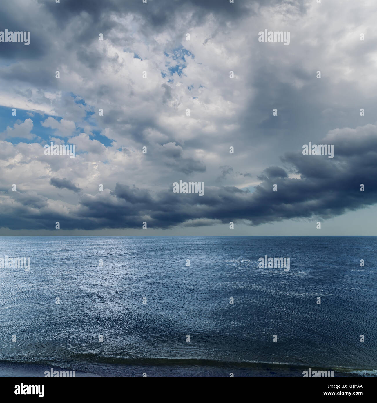 dramatic sky over darken sea. rain before Stock Photo - Alamy