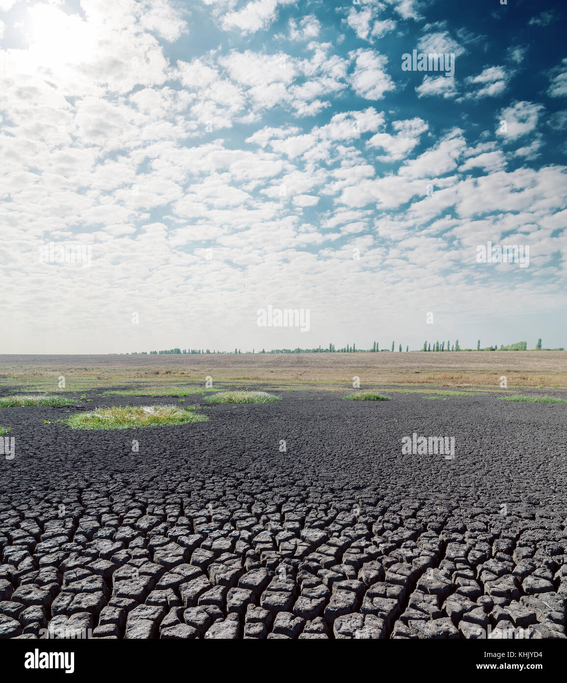 drought earth and hot sun in clouds over it Stock Photo - Alamy