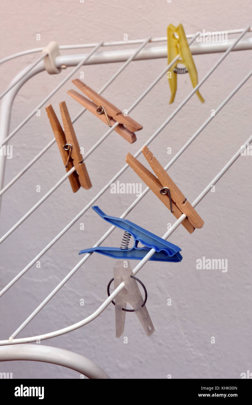 some clothes pegs on an airer or clothes dryer washing line in ...