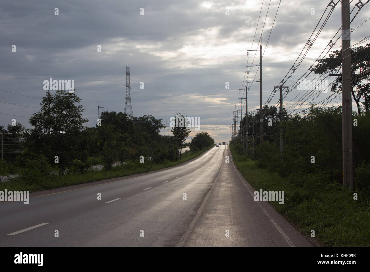 Road with electricity post in sunset, Countryside road with electricity ...