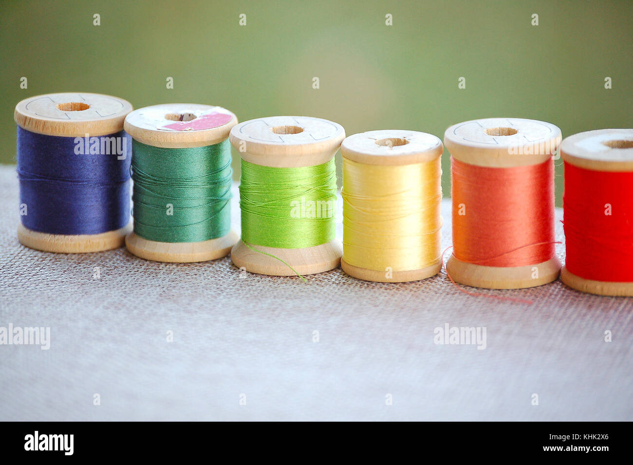 Wooden Spools of Thread in Various Colors Stock Photo - Alamy