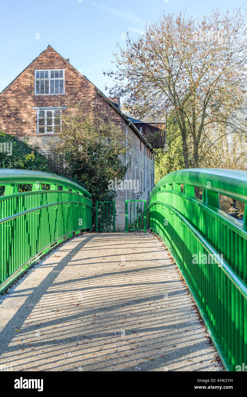 A modern tubular construction bridge painted green Stock Photo - Alamy