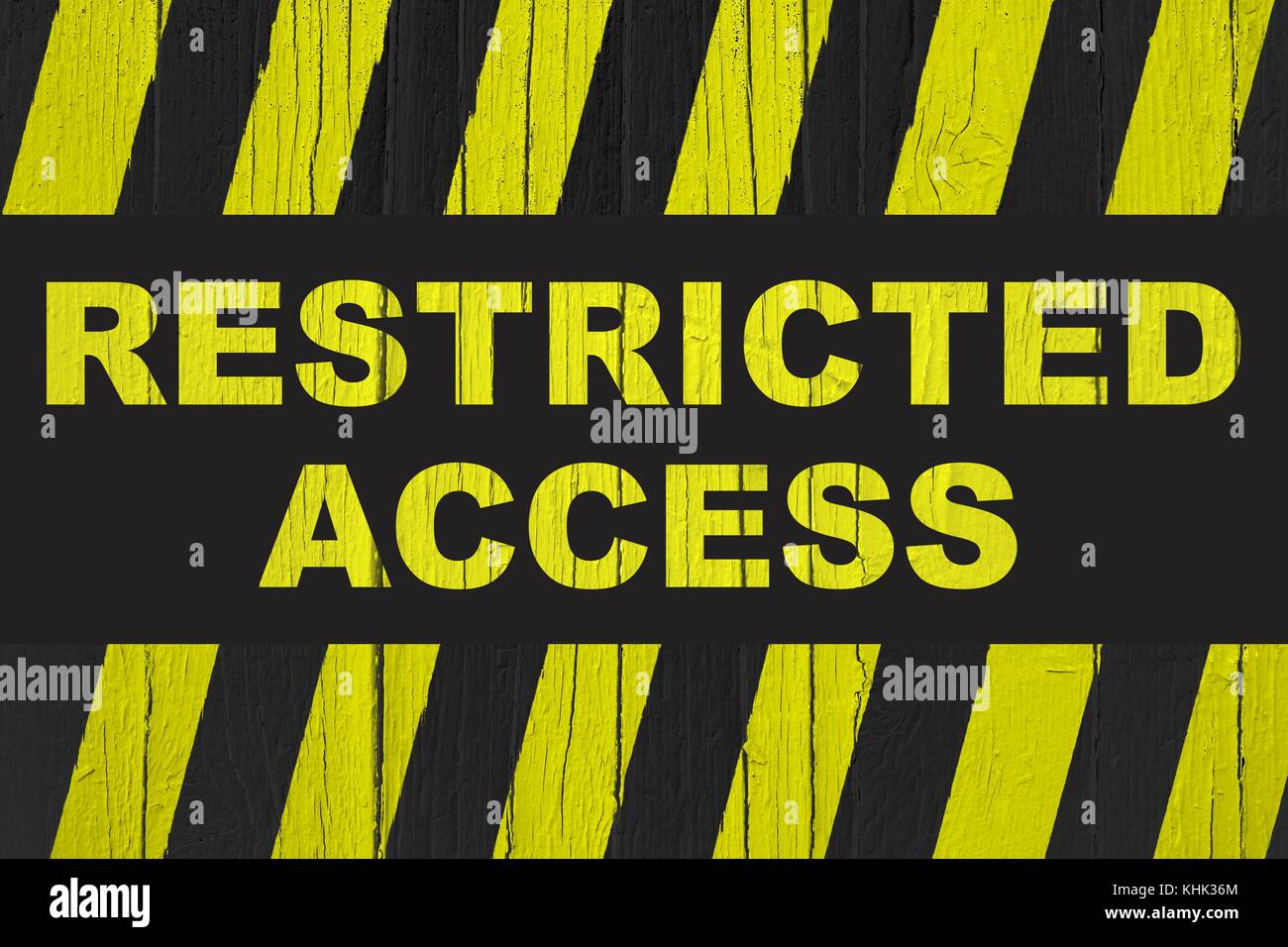 Under construction warning sign with yellow and black stripes painted ...