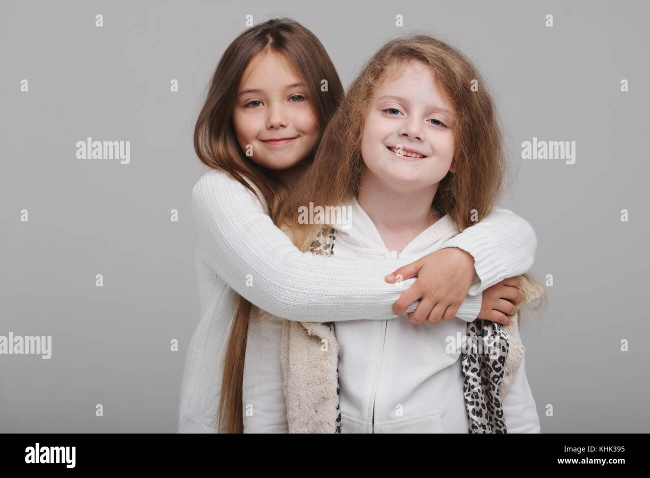portrait of two beautiful girls on white background Stock Photo - Alamy