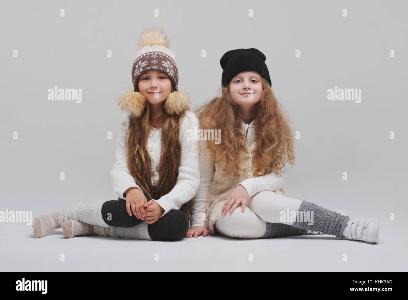 portrait of two beautiful girls on white background Stock Photo - Alamy