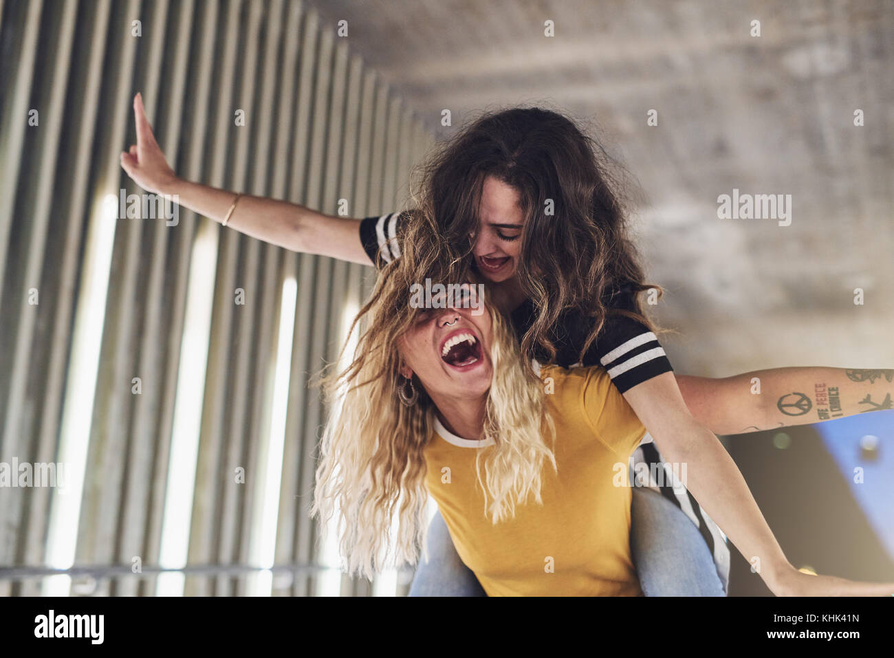 Carrying a friend on shoulders hi-res stock photography and images - Alamy