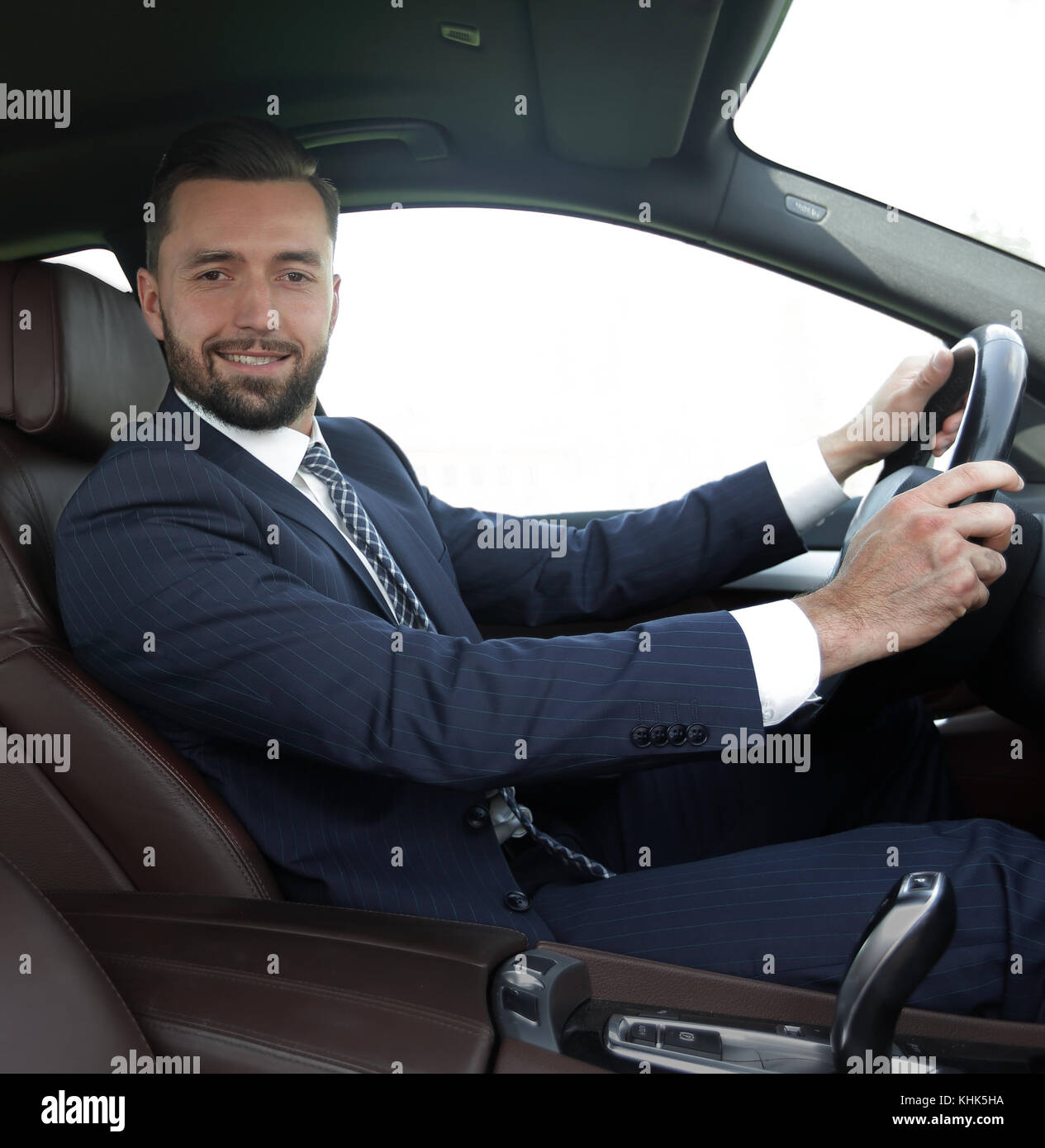 portrait of confident businessman driving a car Stock Photo - Alamy