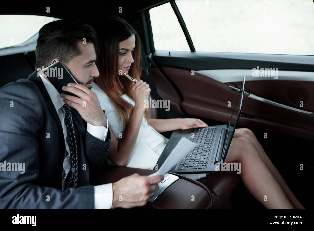 Young business team working together in the car Stock Photo - Alamy