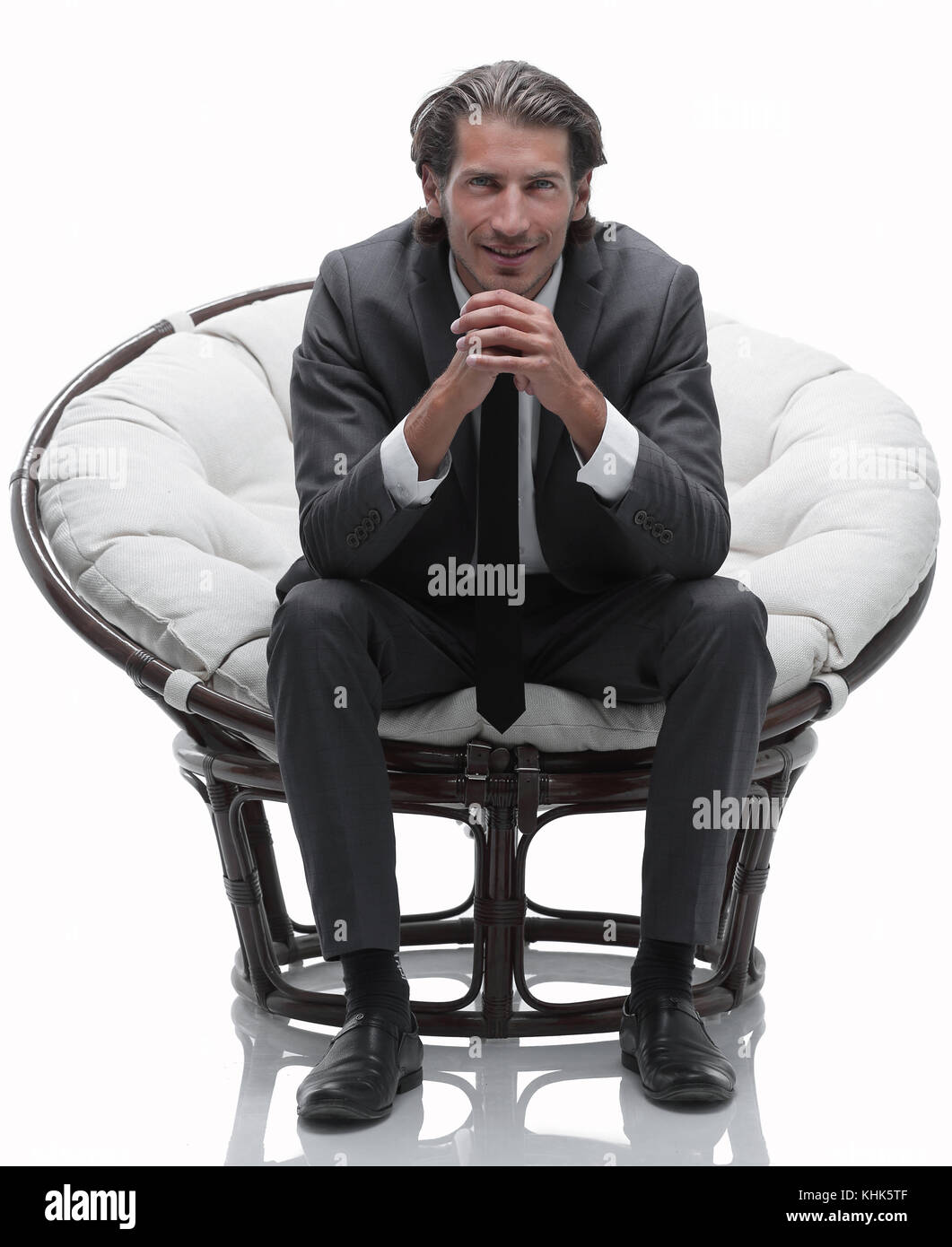 businessman sitting in a comfortable big chair Stock Photo - Alamy